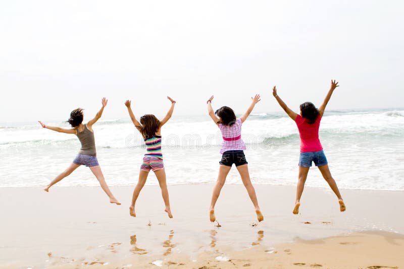 Beach jump stock photo. Image of four, games, joyful - 10972442