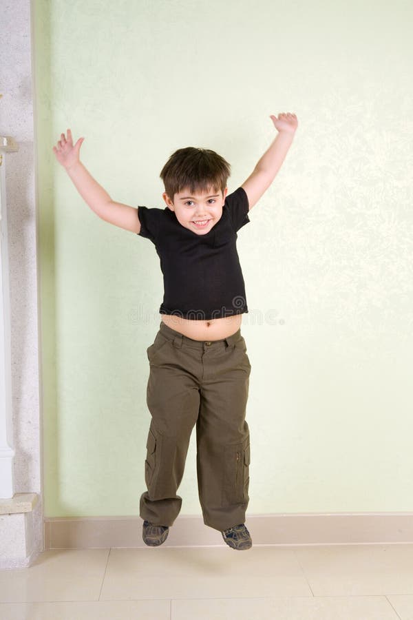Jumping boy stock photo. Image of small, happy, home, domestic - 6856588