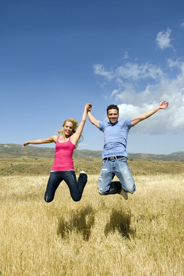 Jumping couple stock photo. Image of relationship, spring - 9526394