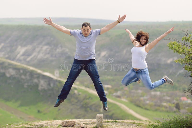 Couple jumping from a pier stock image. Image of bright - 22678361