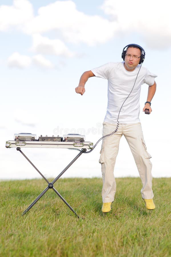Jumping Disc Jockey on Meadow Stock Image - Image of energy, melody ...