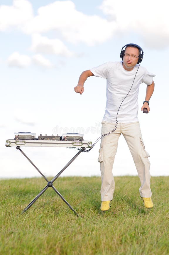 Jumping Disc Jockey on Meadow Stock Image - Image of energy, melody ...