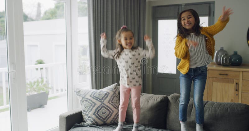 Jumping, Game and ADHD with Kids on Sofa for Hyperactivity, Playful and ...