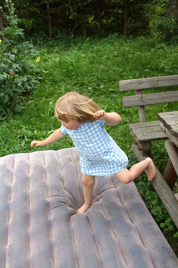 Jumping girl stock photo. Image of table, garden, jump - 1019536