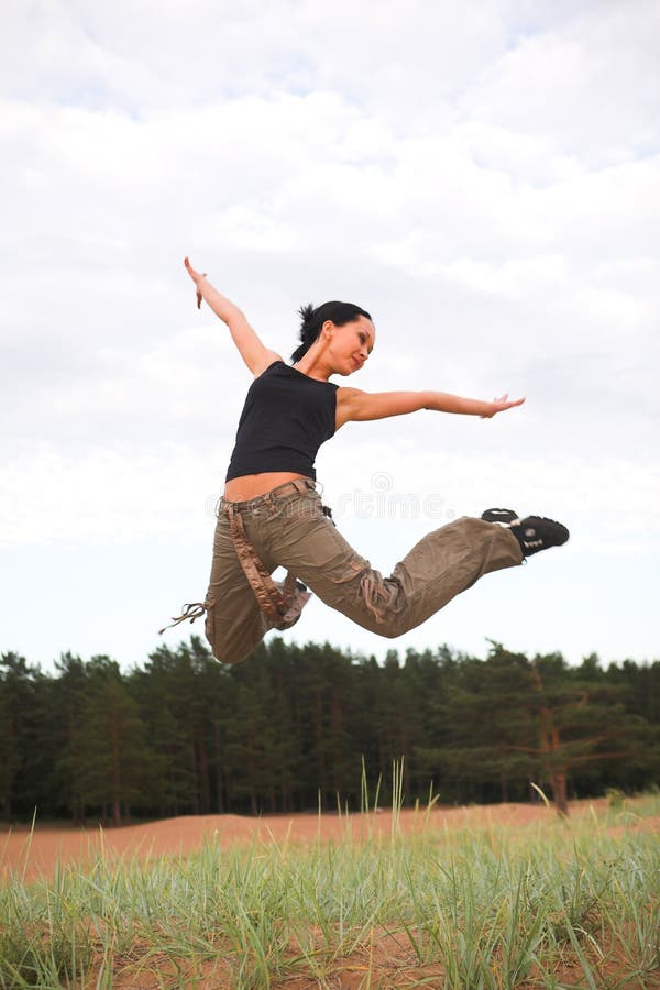Jumping girl stock photo. Image of field, cheerful, healthy - 10581372