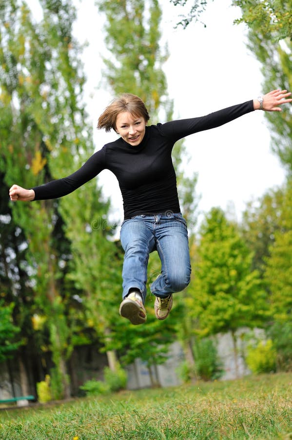 Jumping girl stock photo. Image of female, park, young - 13034480