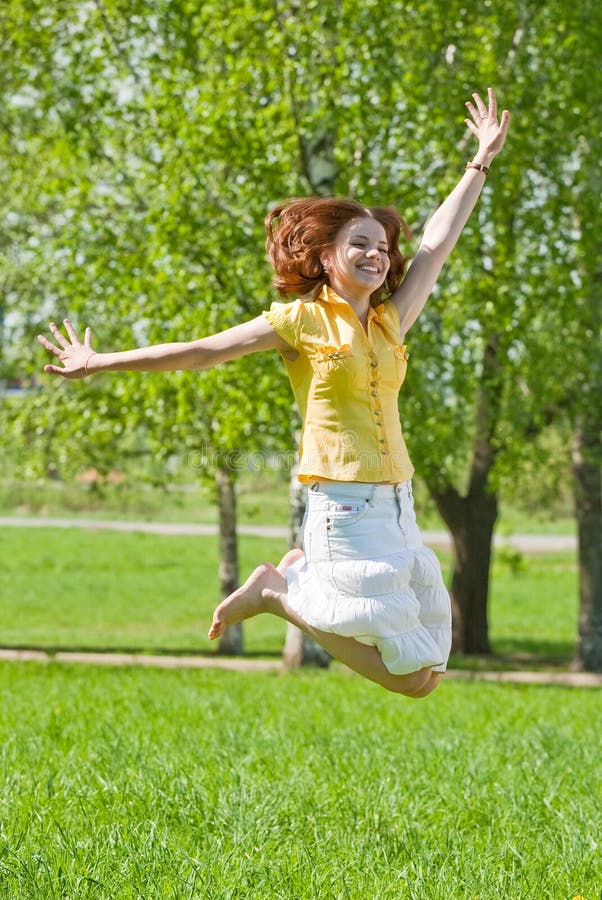 Jumping girl stock photo. Image of active, meadow, blue - 14313776