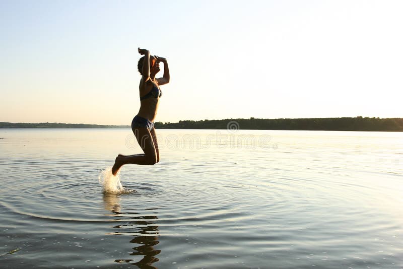Jumping girl stock photo. Image of color, seashore, shore - 147196