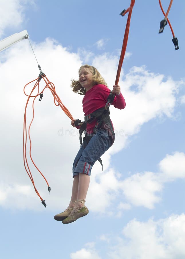 Jumping girl (blue sky) stock photo. Image of girl, funfair - 898660