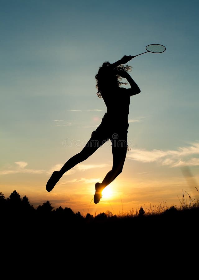 Jumping Girl Playing Badminton Stock Image - Image of fiel, meadow ...