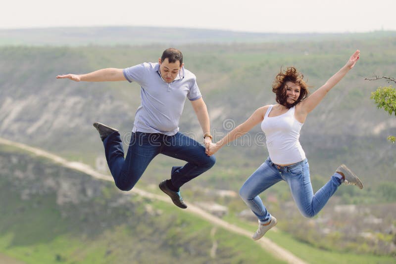 Couple jumping from a pier stock image. Image of bright - 22678361