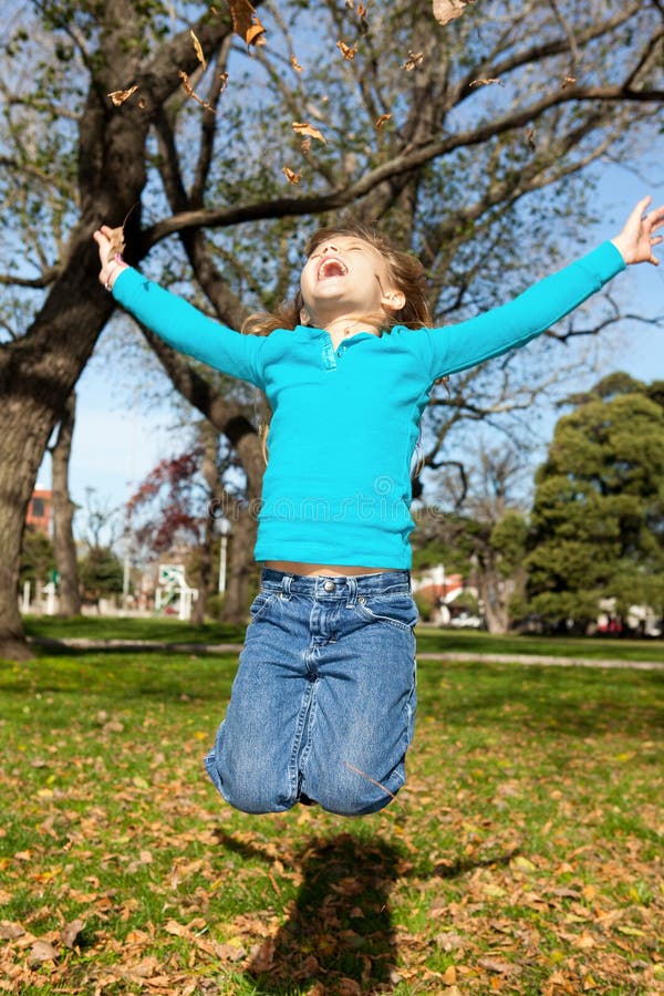 Jumping for joy stock photo. Image of smiling, adorable - 24582518
