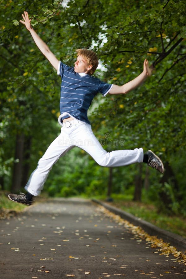 Jumping man stock photo. Image of park, feat, jump, blonde - 11487154