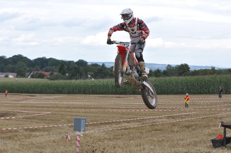 Jumping motocross driver editorial photo. Image of balance - 43777031