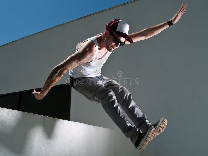 Jumping off a building stock photo. Image of tatoo, running - 20240008