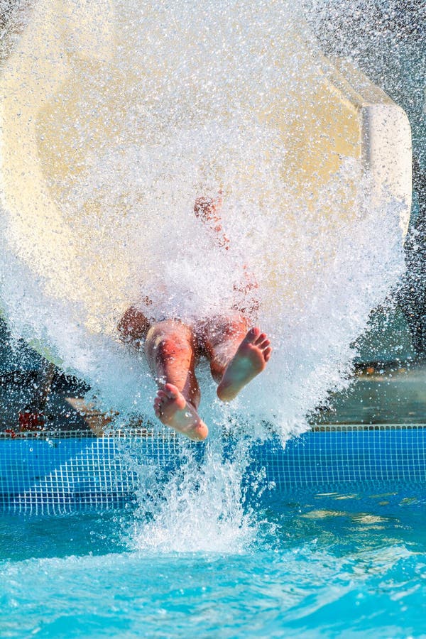 Jumping Out of the Water Slide Stock Image - Image of island, slide ...