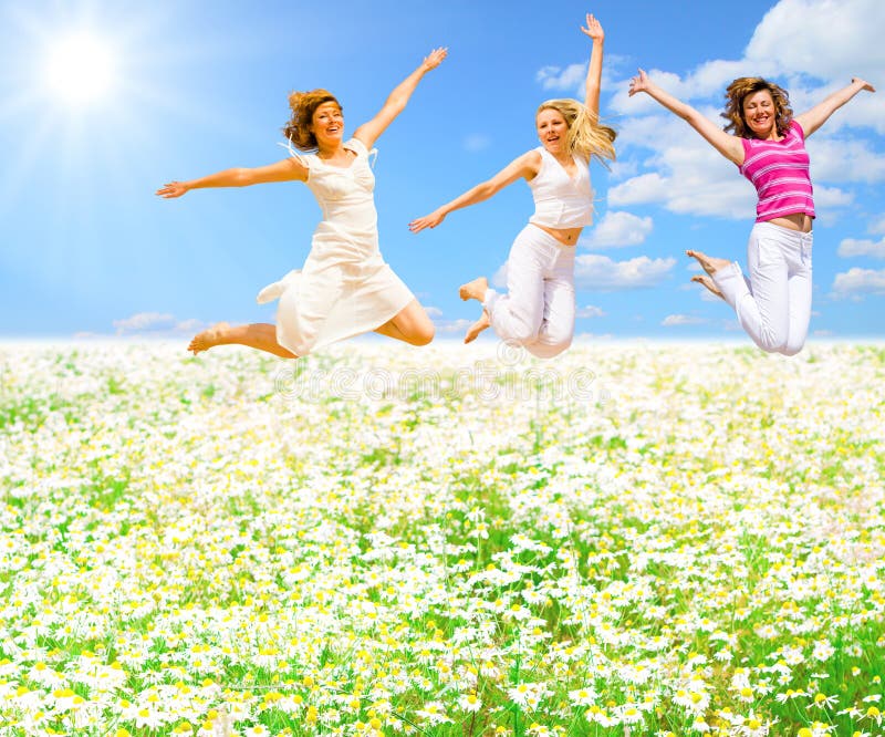 Jumping over flower field stock photo. Image of couple - 6251730