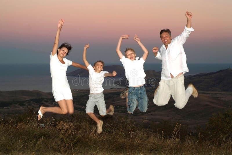 Jumping people together stock image. Image of family - 27601389