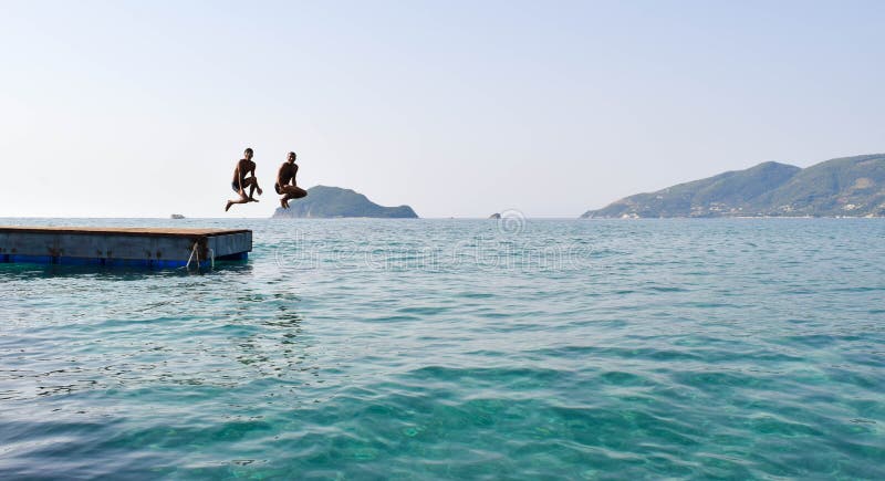 Jumping into the Sea from the Pontoon. Stock Image - Image of marine ...