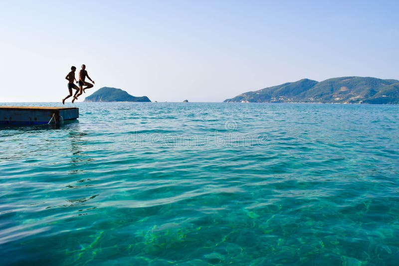Jumping into the Sea from the Pontoon. Stock Image - Image of seaside ...