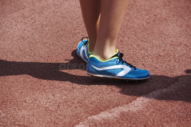 Jumping Sport Shoes in the Athletic Field Ground Stock Photo - Image of ...