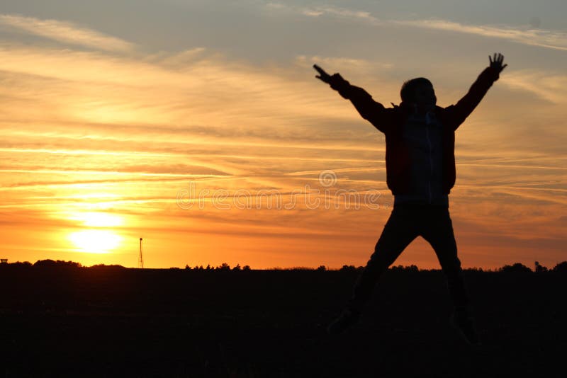 Jumping Sunset stock photo. Image of sunset, joie, ombres - 144695836
