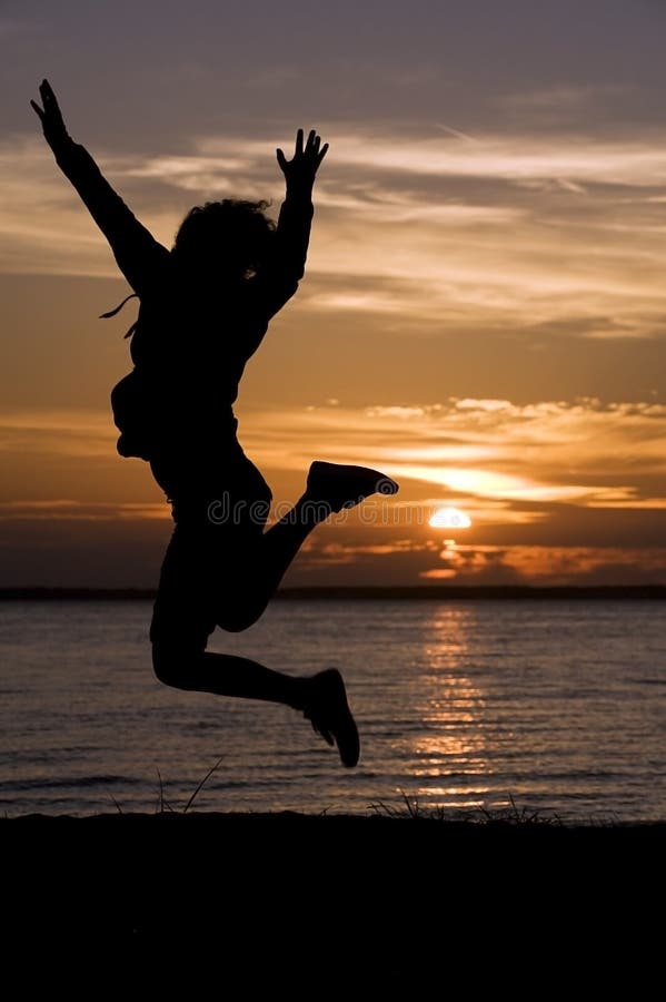 Jumping in sunset stock image. Image of silhouette, happy - 37646587