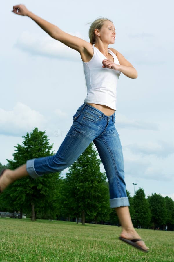 Jumping woman. stock photo. Image of park, flexibility - 5661240