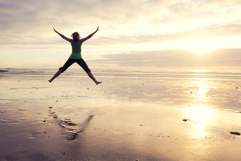 Jumping on the beach stock image. Image of fitness, jump - 2244911