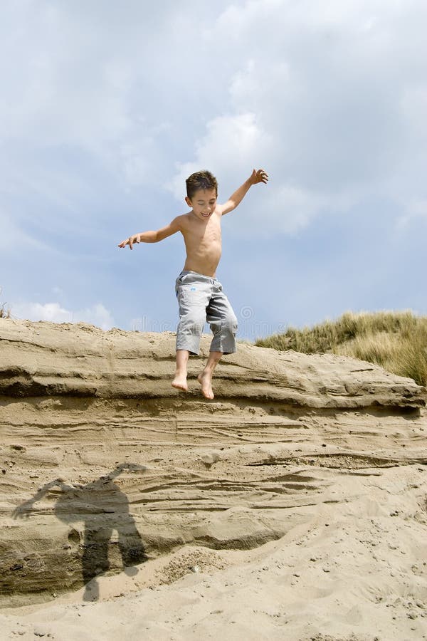 Jumpingboy stock image. Image of male, sand, summer, beach - 5075227