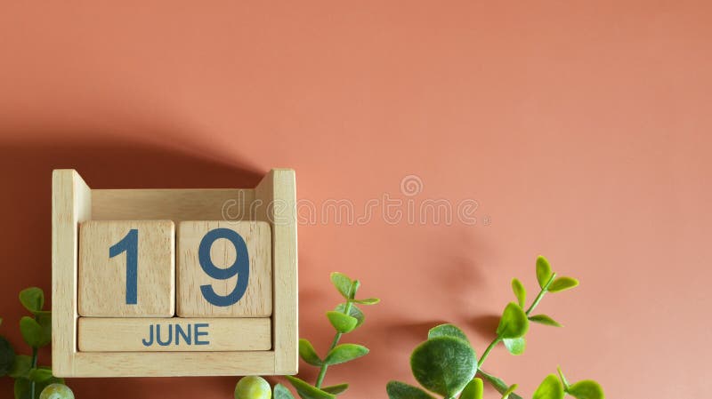 June 19, Date Design with Calendar Cube and Leaf on Orange Background ...