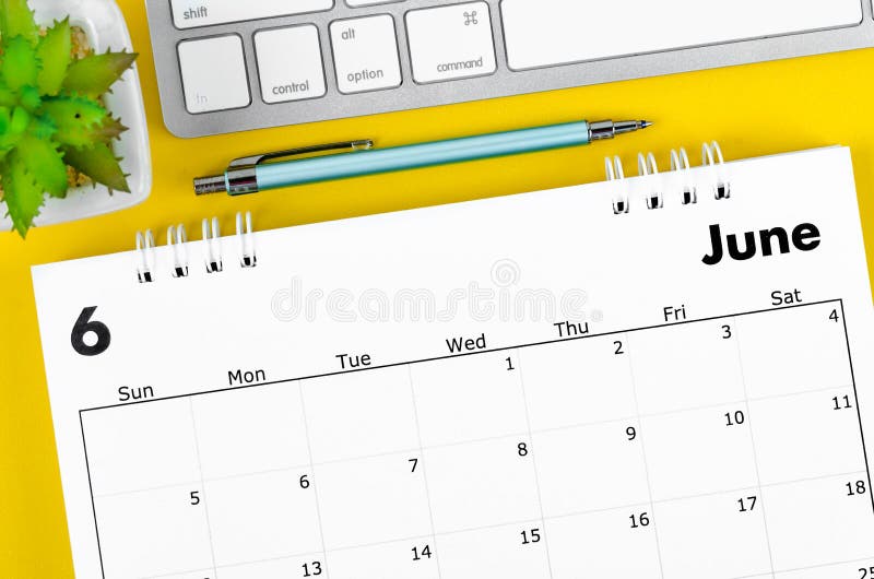 June 2022 Desk Calendar with Pen and Keyboard Computer on Yellow ...