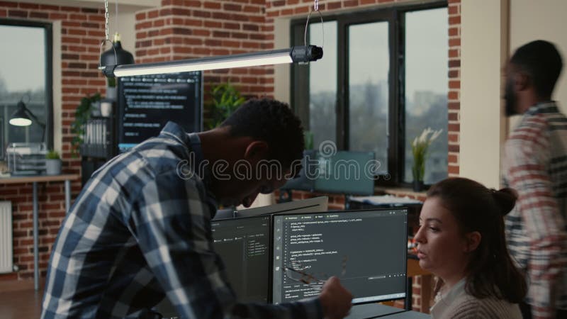 Junior Developer Putting Laptop with Source Code on Senior Dev Desk Asking for Opinion Stock ...