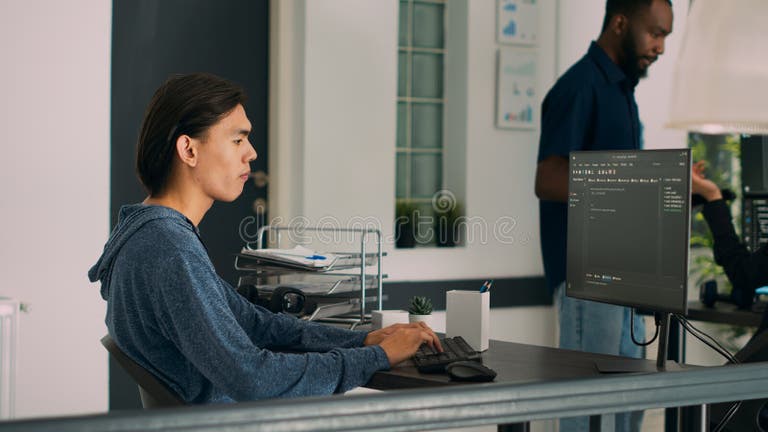 Junior Developer Writing Database Code To Create New User Interface on Computer Stock Image ...