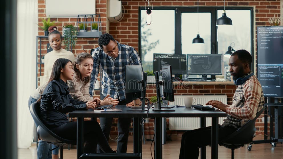 Junior Developers Collaborating on Group Project Compiling Algorithm Asking Senior Programer for ...