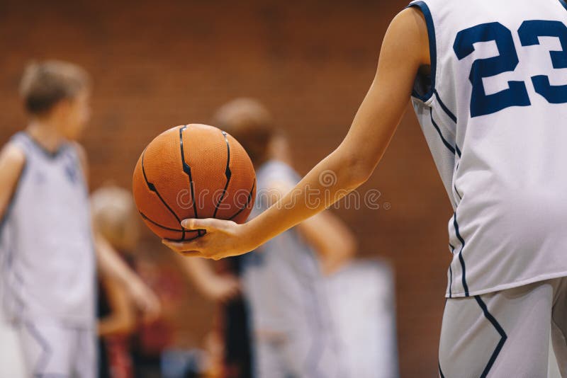Junior Level Basketball Player Holding Game Ball at Practice Drill ...