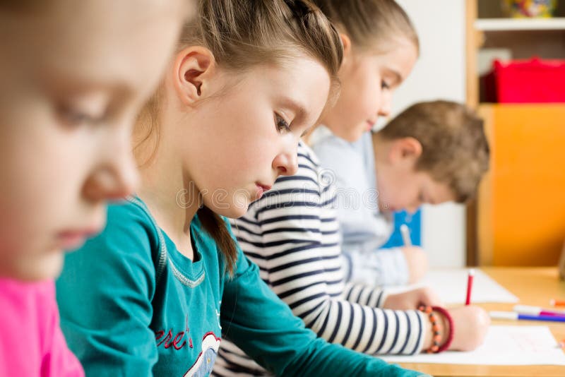 Junior Pupils Drawing with Highlighters Stock Image - Image of sitting ...