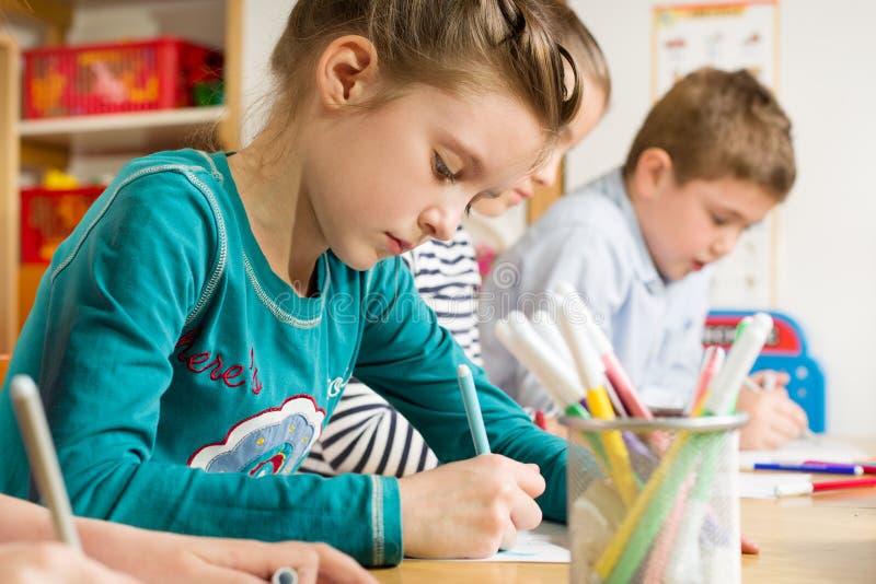 Junior Pupils Drawing with Highlighters Stock Photo - Image of desk ...