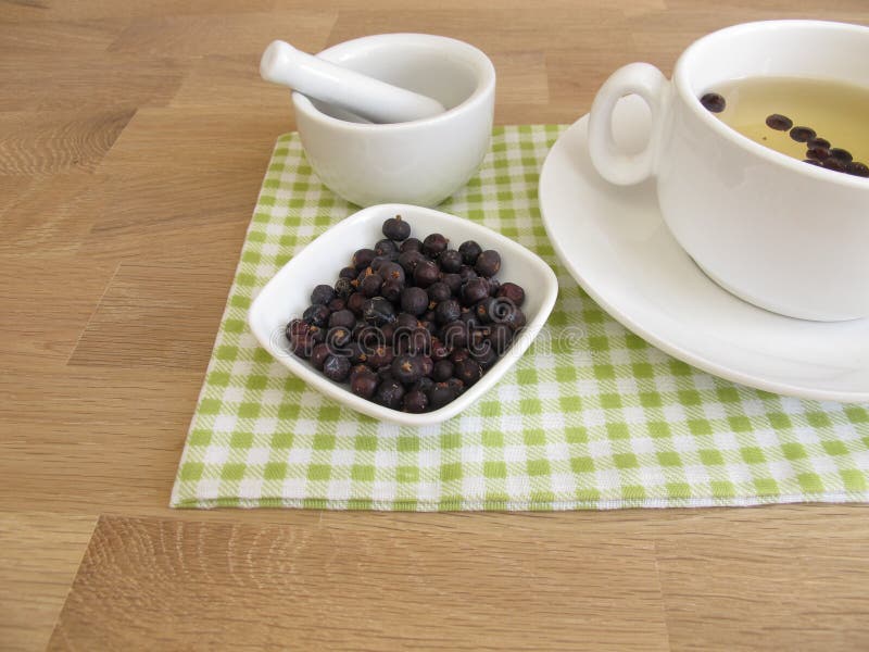 Juniper Berries Tea and Dried Juniper Berries Stock Photo - Image of ...