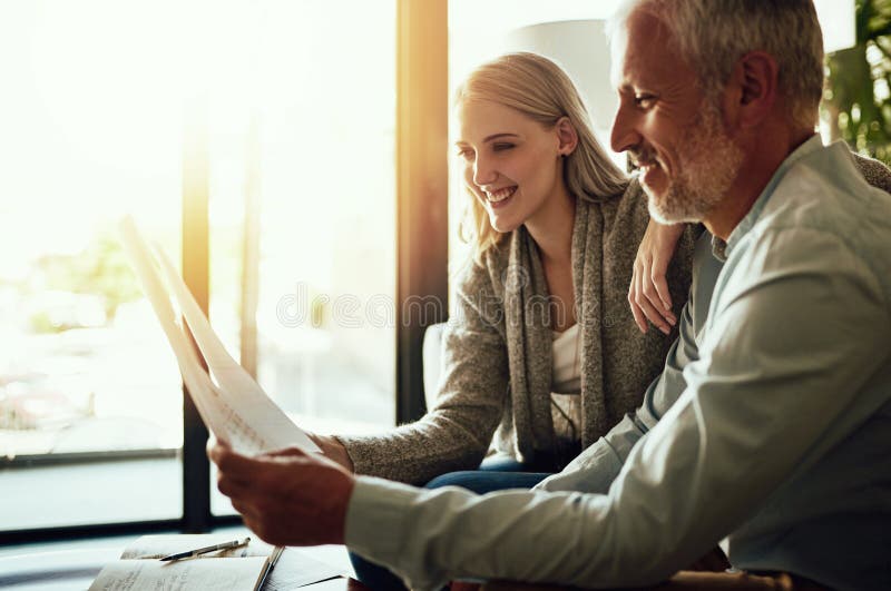 Just Another Day at Home. a Couple Going through Their Paperwork ...