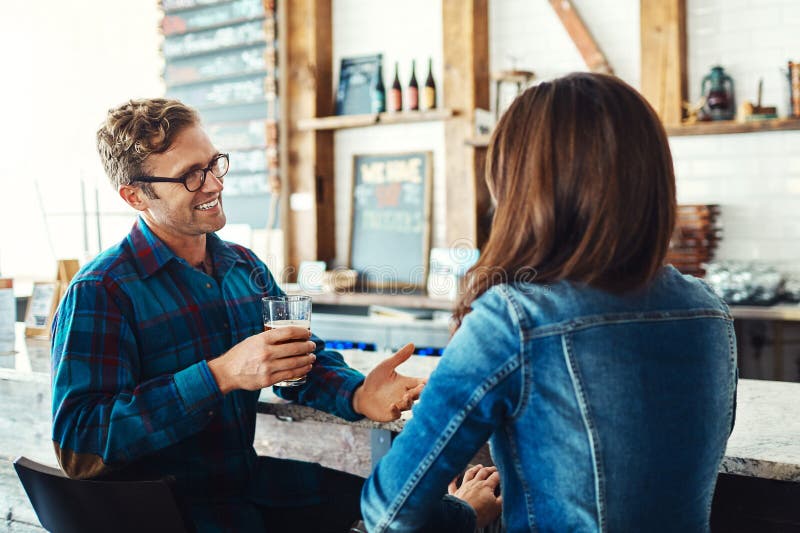 Just Another before You Go. a Couple Enjoying a Drink at a Bar. Stock ...