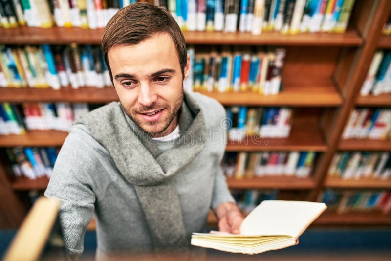 Just the Book I Need. a University Student Looking for a Book in the ...