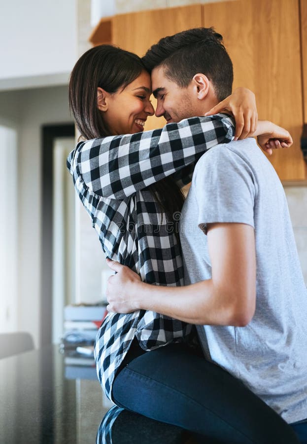 They Just Cant Get Enough Of Each Other A Happy Young Couple Celebrating Their Move Into A New