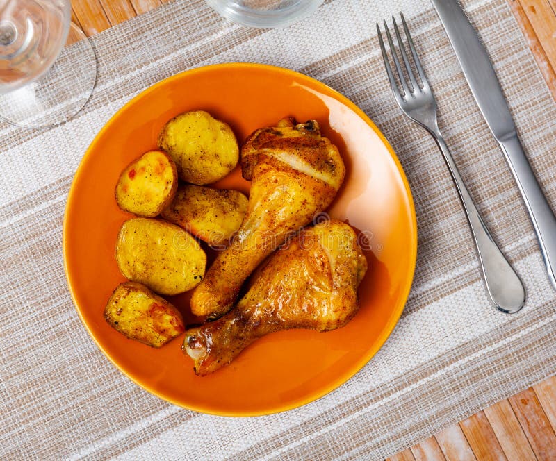Just Cooked Chicken Leg with Fried Potatoes Stock Image - Image of ...
