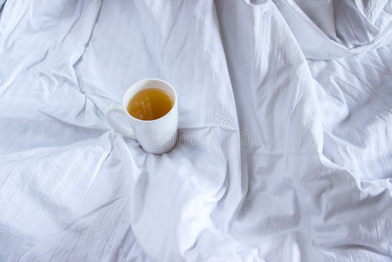 Cup of tea in the bed stock photo. Image of mood, good - 160554314