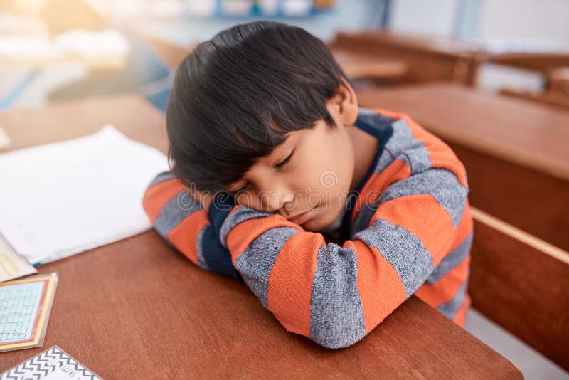 Just Five More Minutes. a Tired Elementary School Child Sleeping on His ...