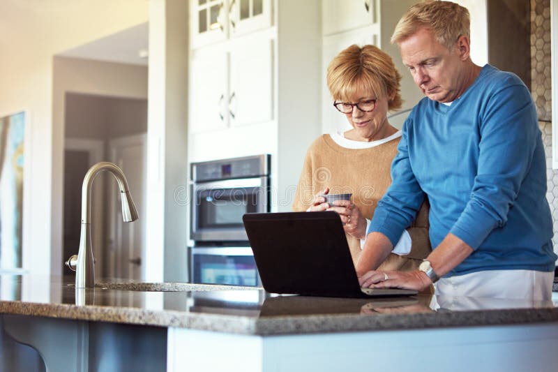 Just Gotta Enter the Password...a Mature Couple Using Their Laptop in ...