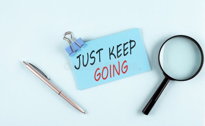 JUST KEEP GOING Text Written on Sticky with Magnifier and Pen, Business ...