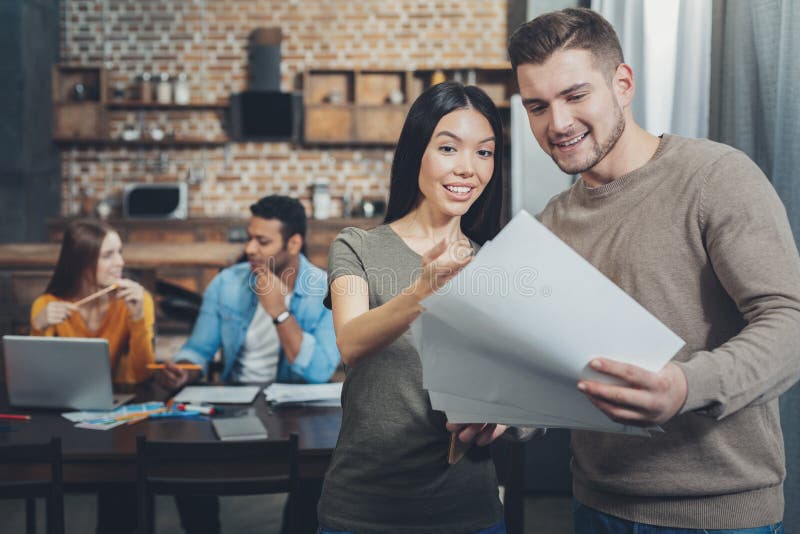 Busy Two Colleagues Scrutinizing Documents Stock Image - Image of ...