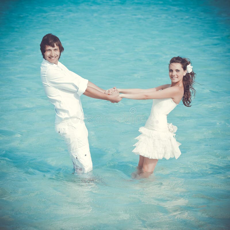 Just Married Couple in the Sea Stock Image - Image of romance, smiling ...